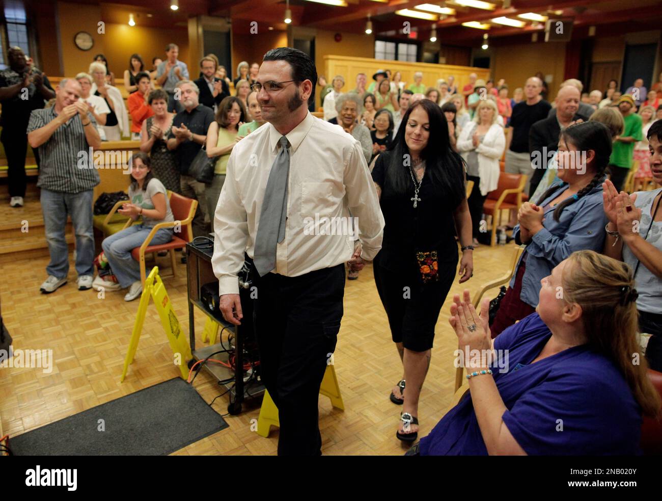 In this Saturday, Aug. 6, 2011 photo, Bryon Widner, center left, and ...