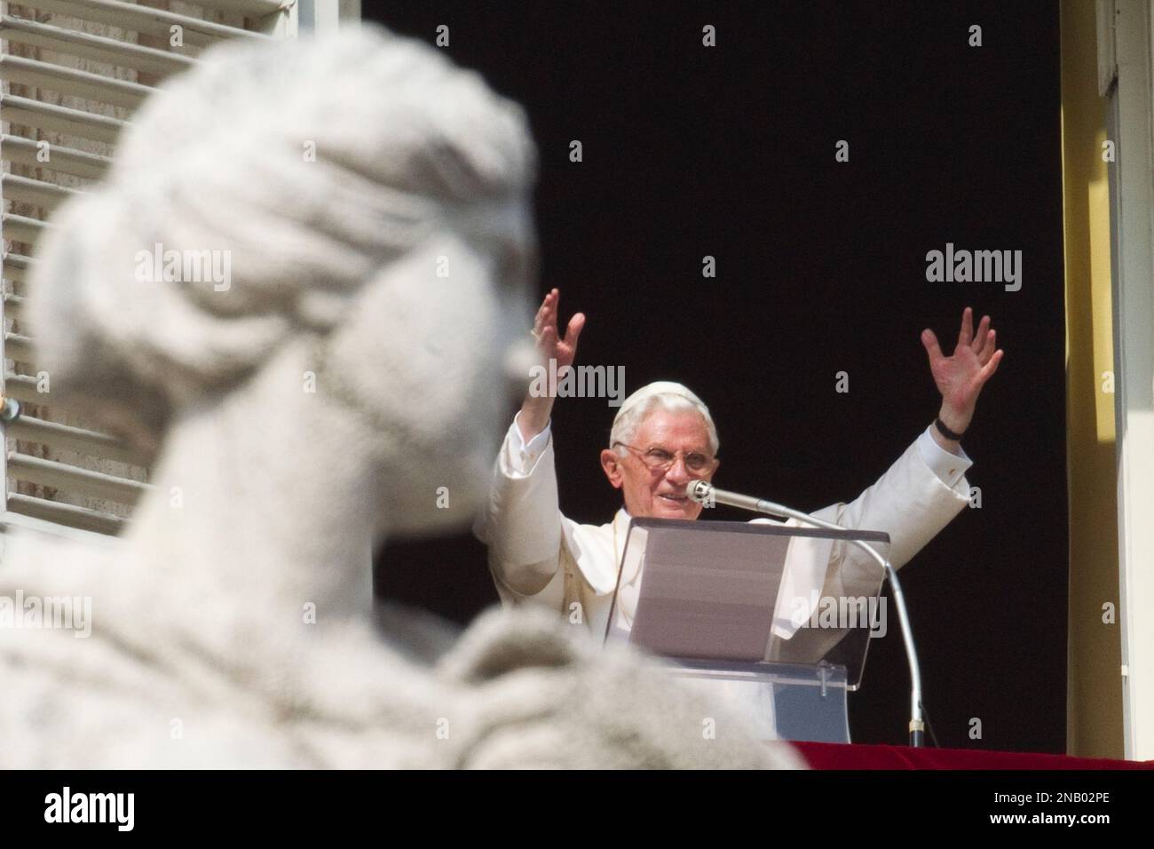 Pope Benedict XVI delivers his blessing to the faithful during the ...