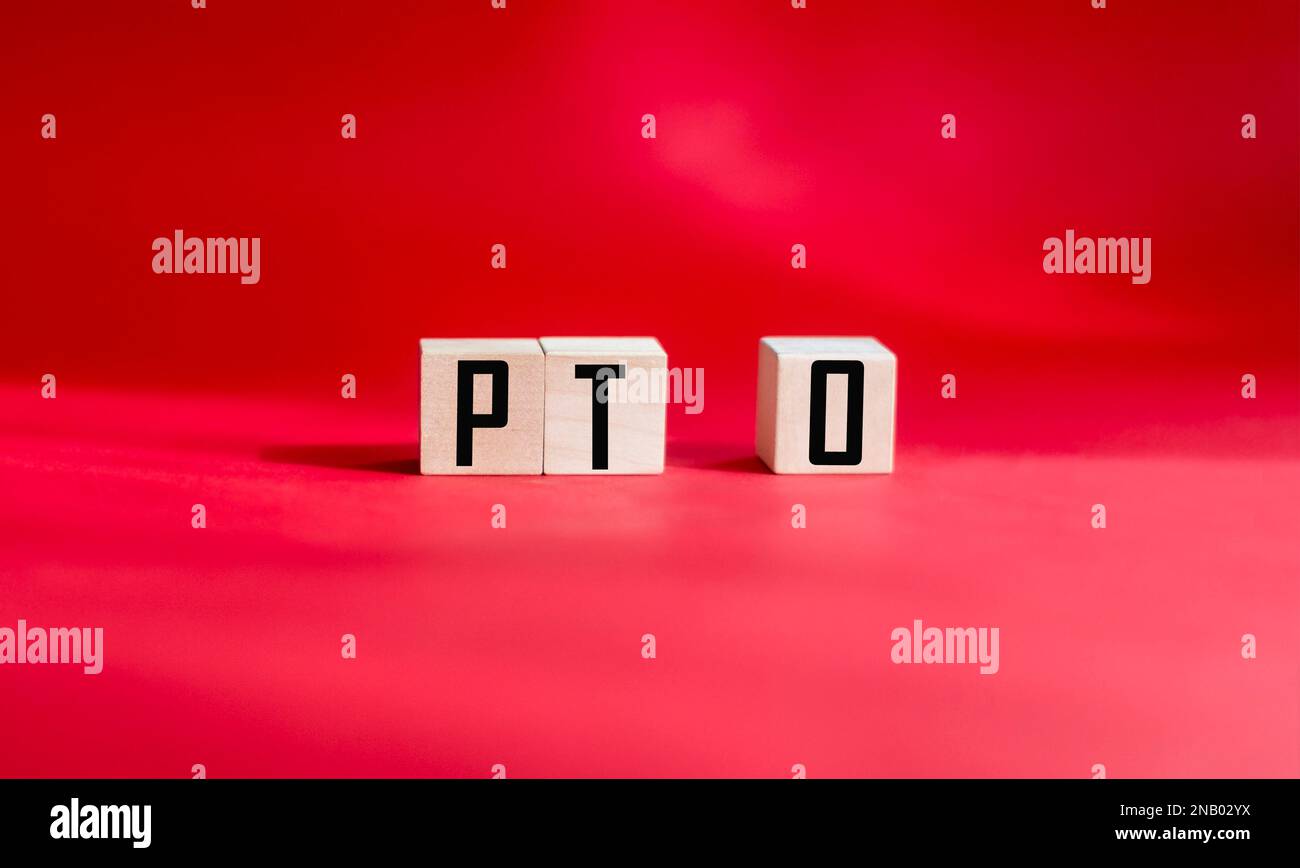 the word pto with wooden building blocks on a red background. Concept ...