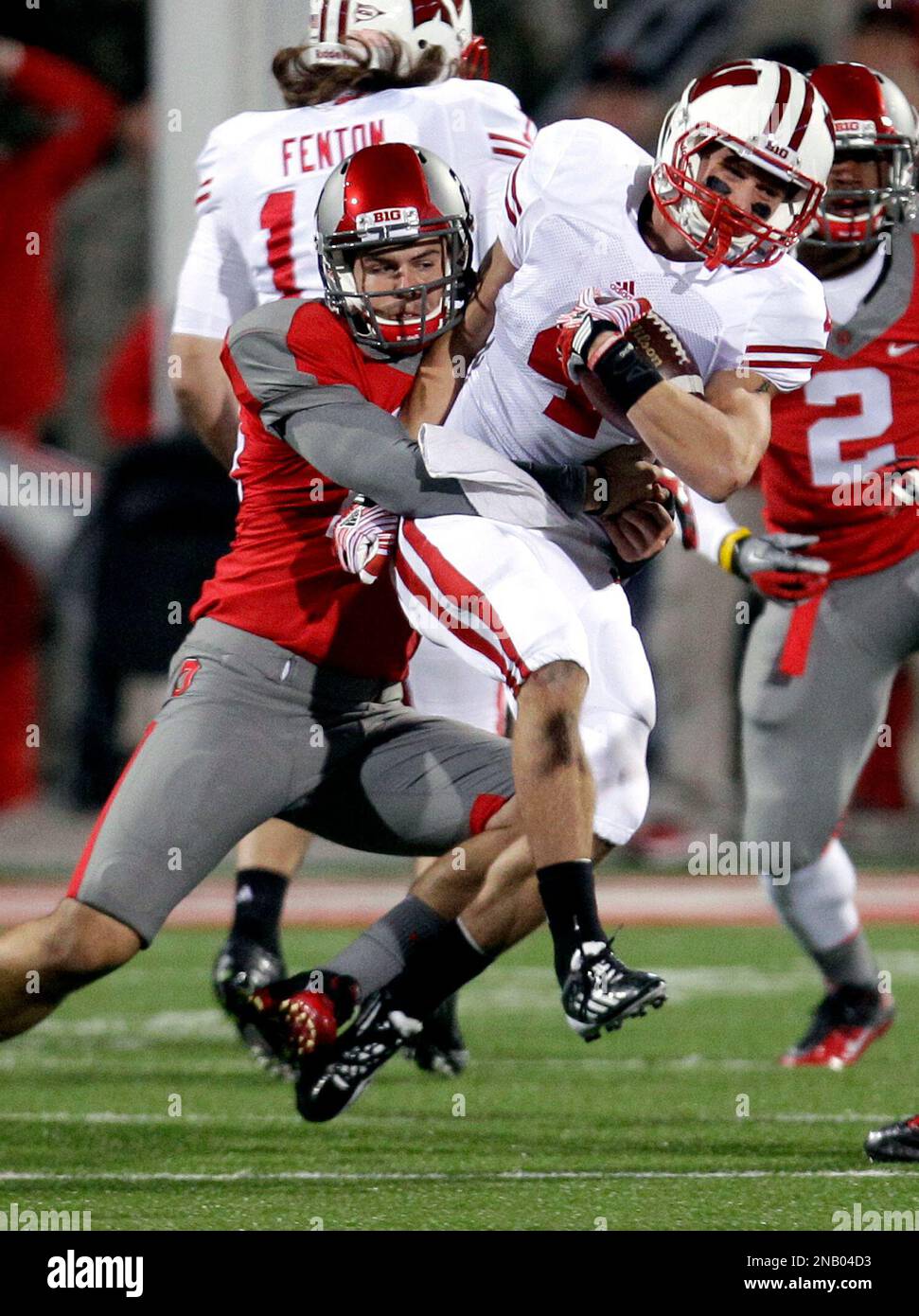 Ohio State kicker Drew Basil (24) tackles Wisconsin wide receiver Jared ...