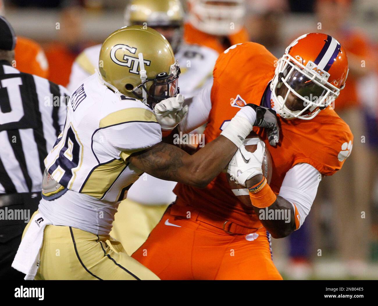 Clemson wide receiver Jaron Brown (18) tries to escape from Georgia ...
