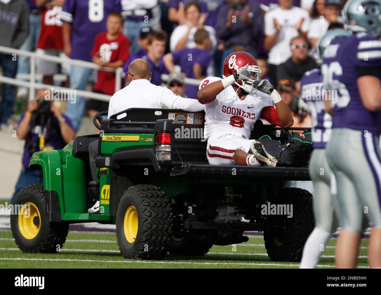 Oklahoma running back Dominique Whaley (8) signals to his team as he is ...
