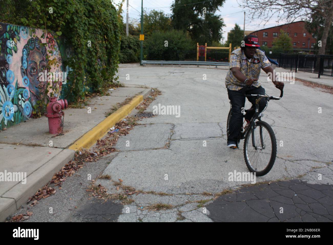 In this Tuesday, Oct. 11, 2010 photo, Reginald Graham rides his bike on ...