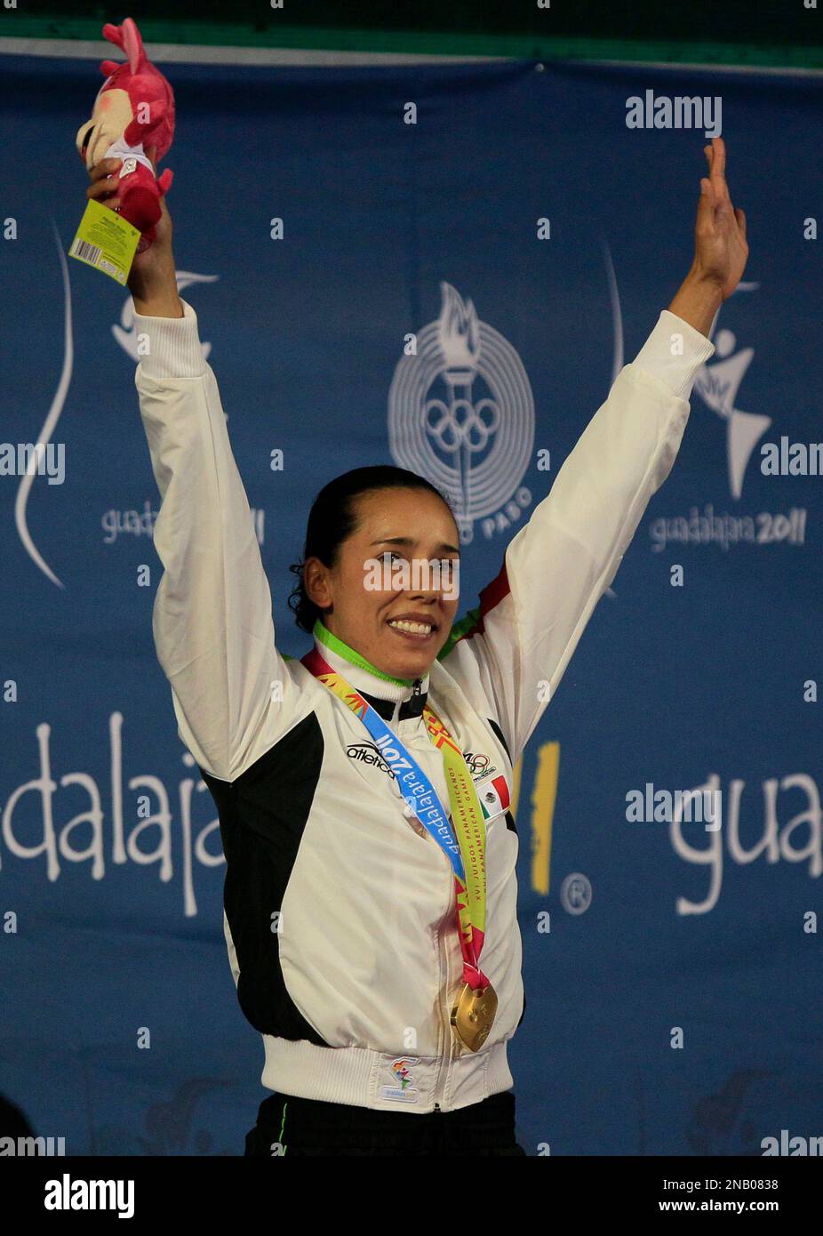Mexico's Laura Sanchez celebrates her gold medal during the award ...