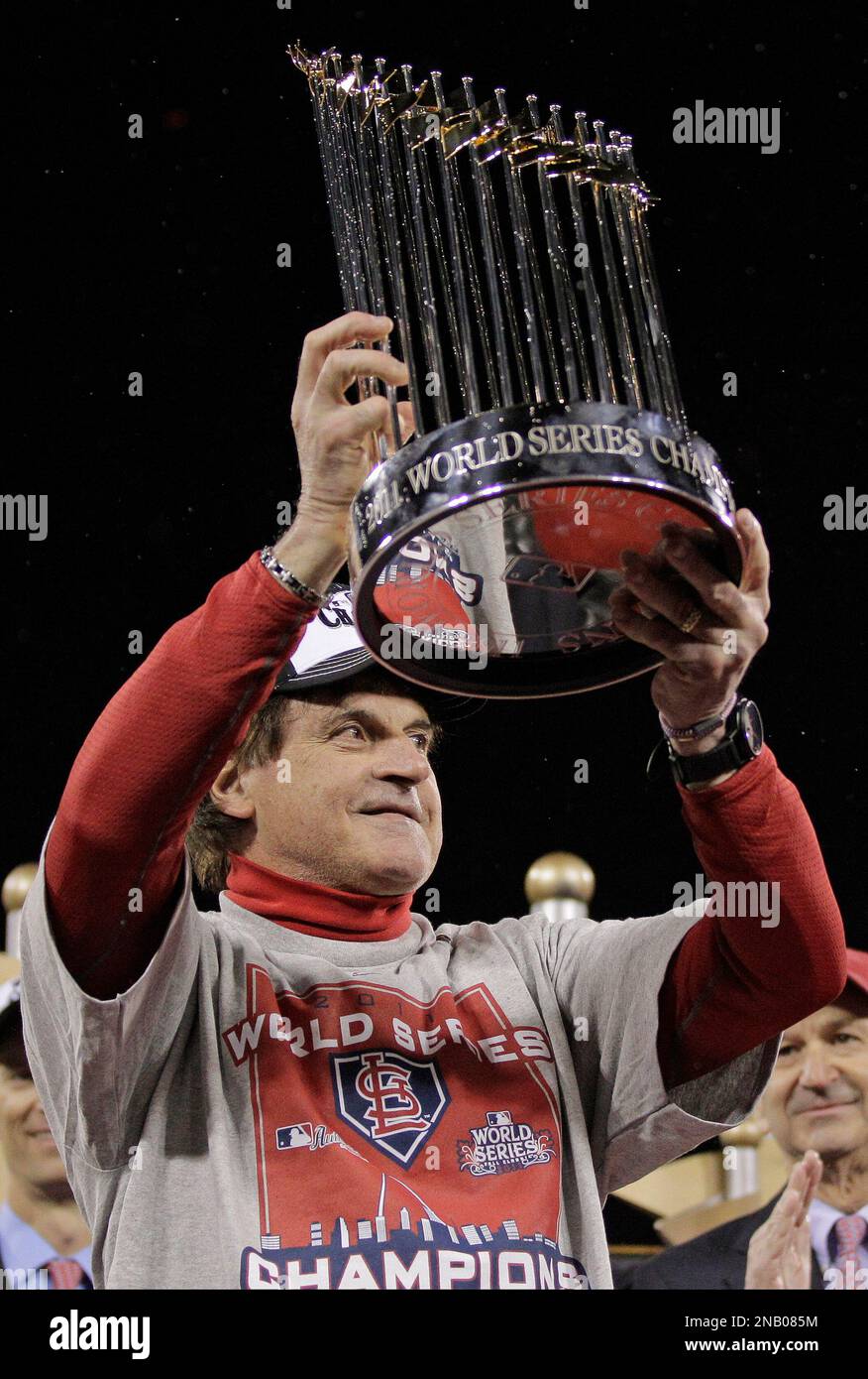 St. Louis Cardinals' Tony La Russa holds up the Commissioner's Trophy ...