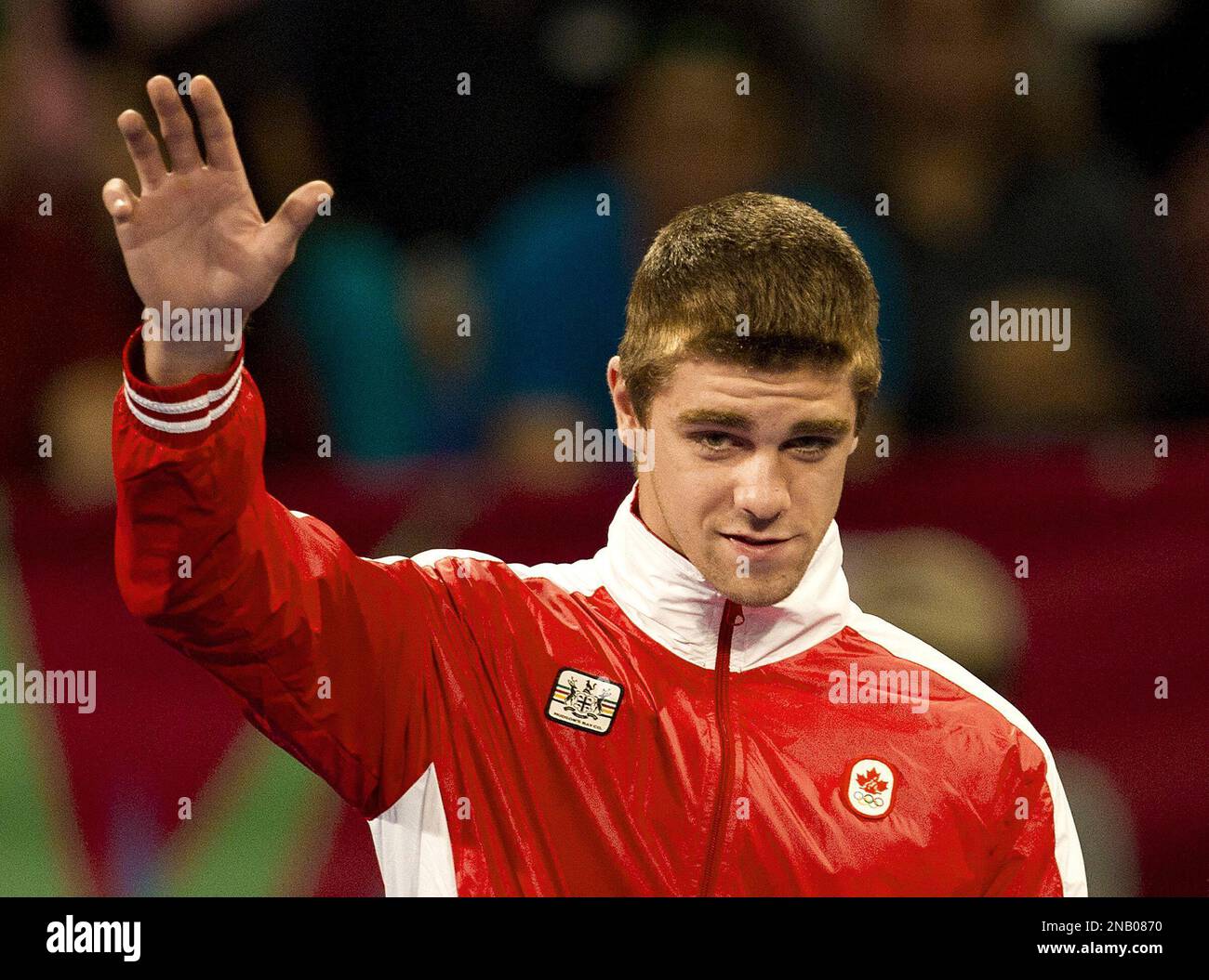 Canada's Brody Blair waves to the crowd after winning the bronze medal ...