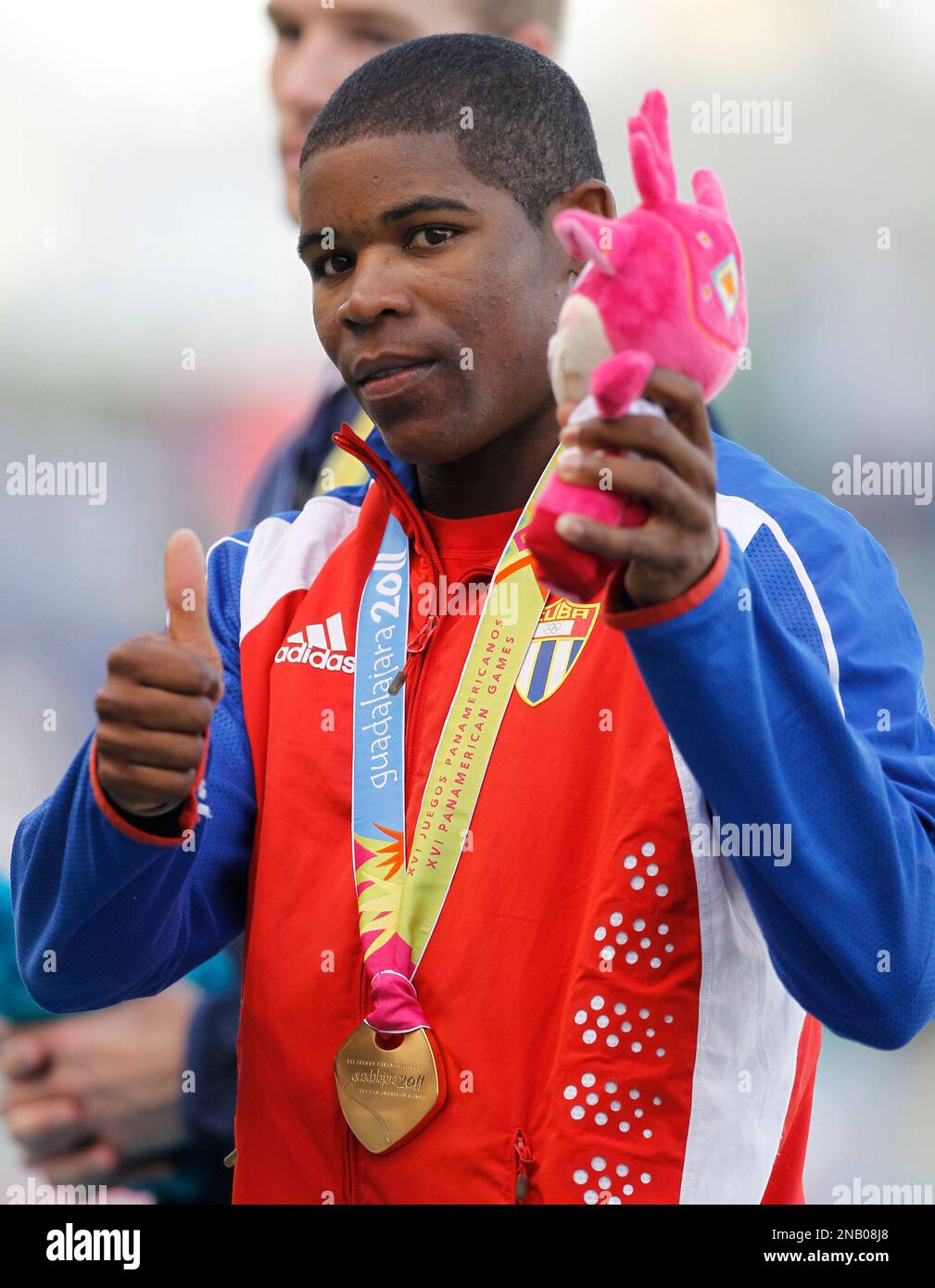 Gold medalist Eduardo Borges of Cuba gives a thumbs up in he podium of ...