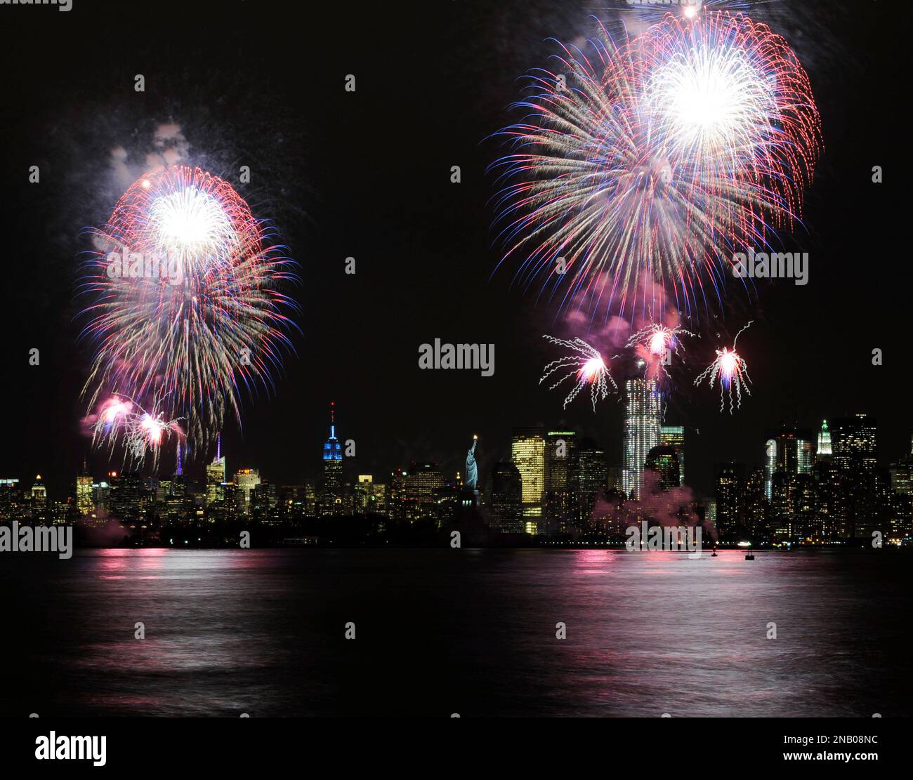 A fireworks display over the Statue of Liberty commemorates the 125th ...