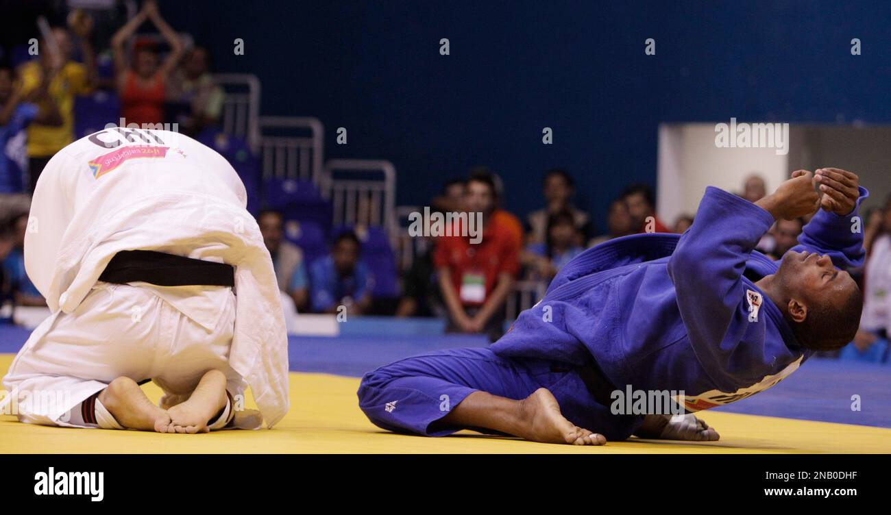 Mexico's Isao Cardenas, right, reacts after winning the bronze medal ...