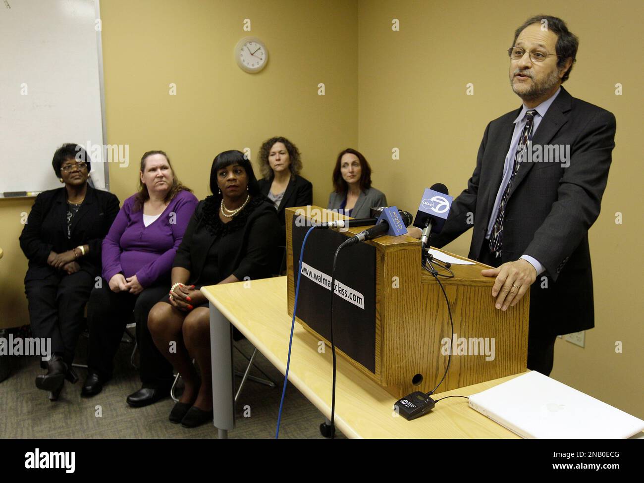 Attorney Brad Seligman, right, speaks as Betty Dukes, from left ...