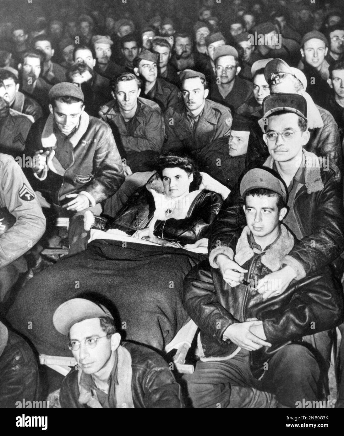 Yvette Hamel, center, 16-year-old French girl, enjoys a GI show in ...