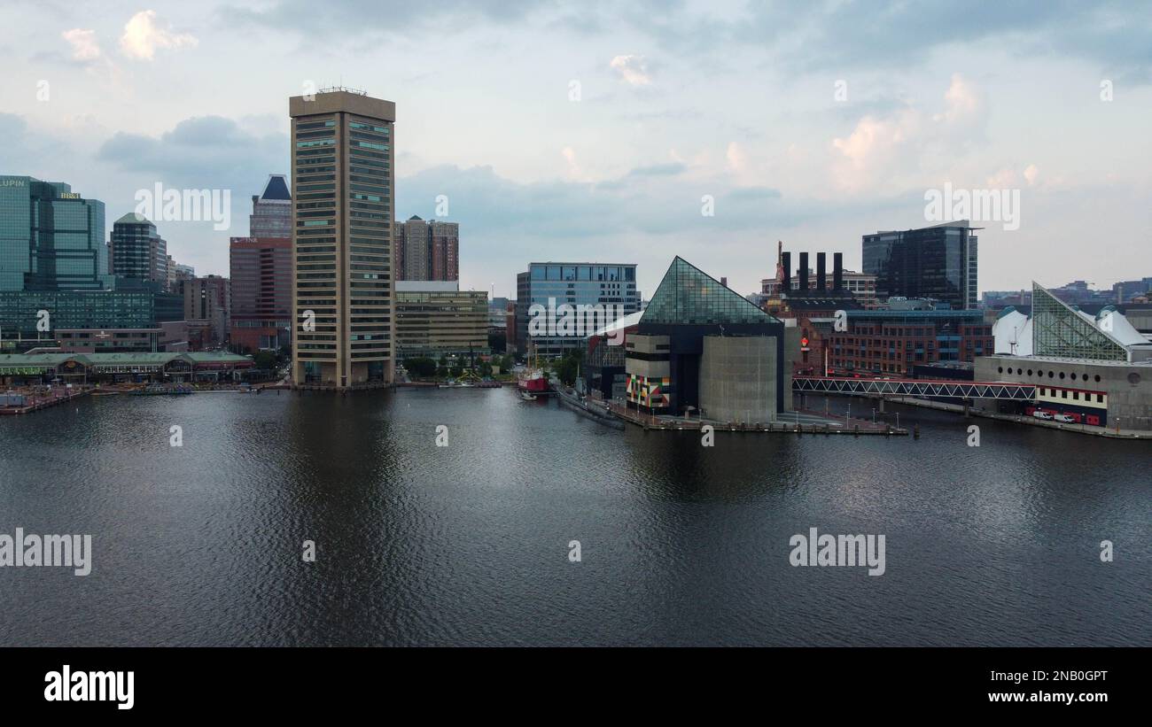 An aerial view of modern buildings and structures near the shore in ...