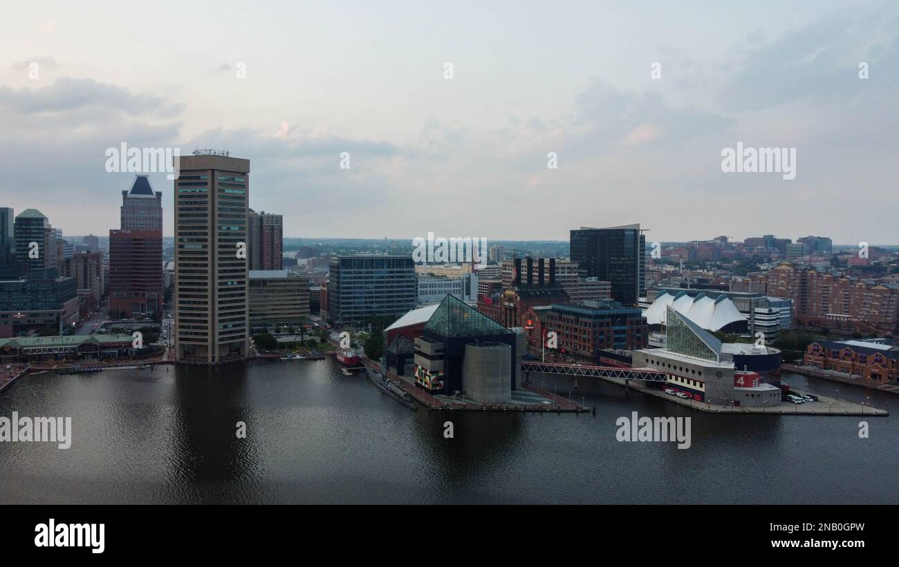 An aerial view of modern buildings and structures near the shore in ...