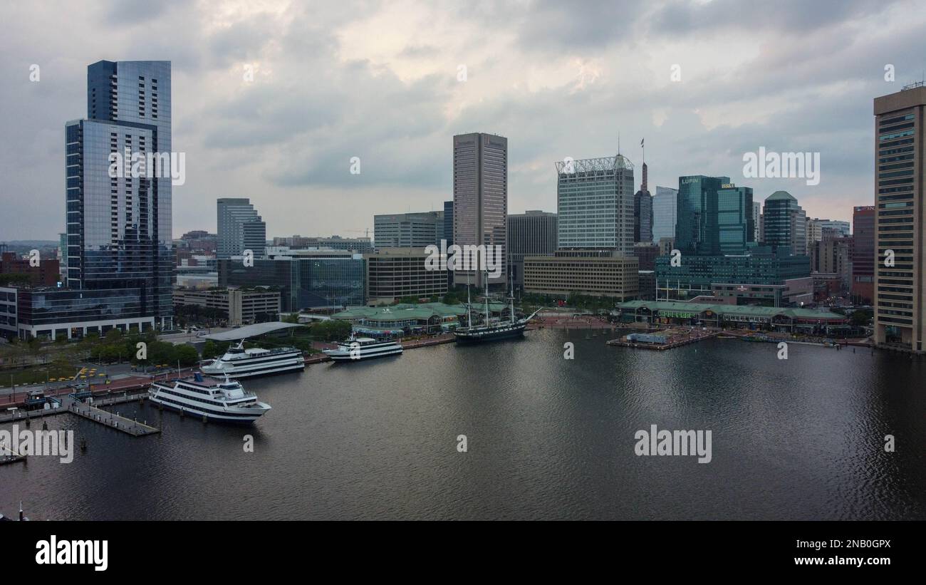 An aerial view of modern buildings and structures near the shore in ...