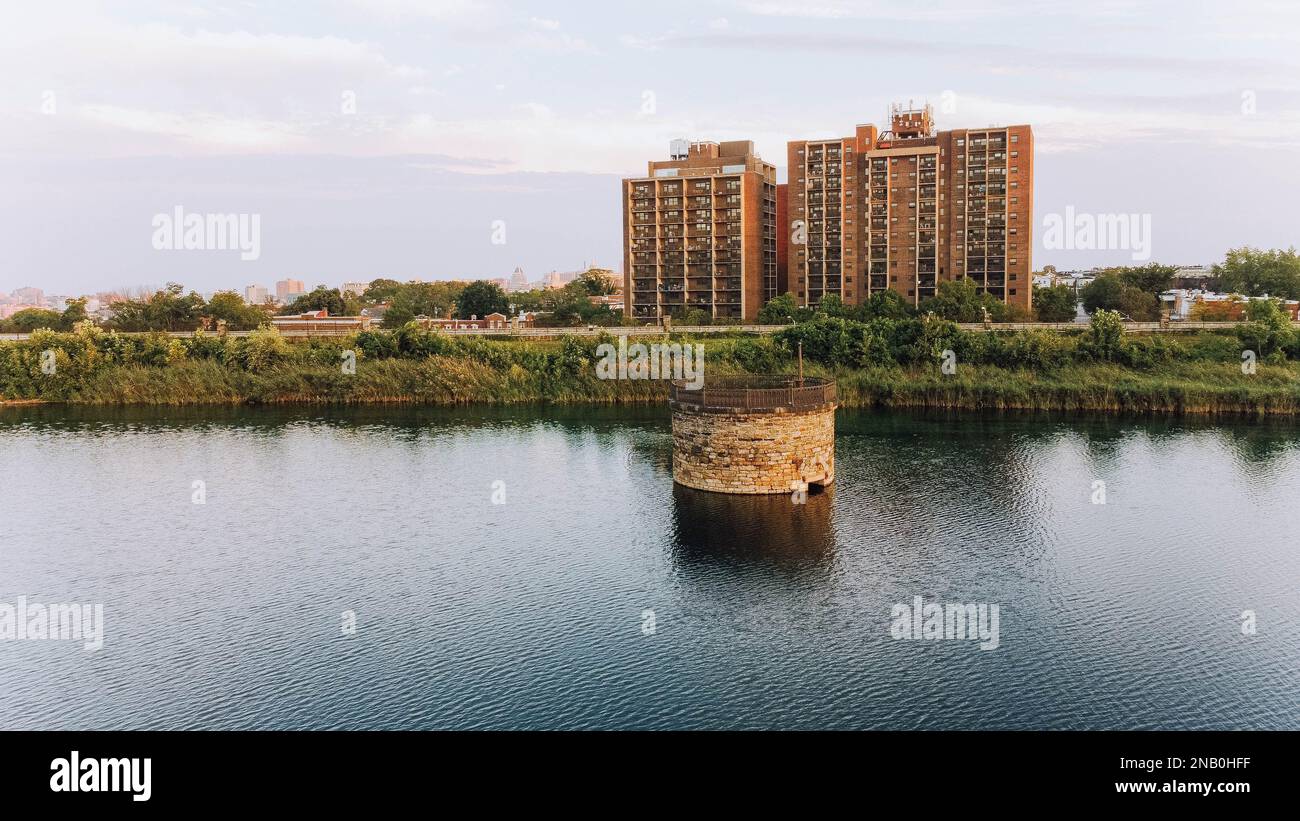 An aerial view of residential brick buildings near the water in ...