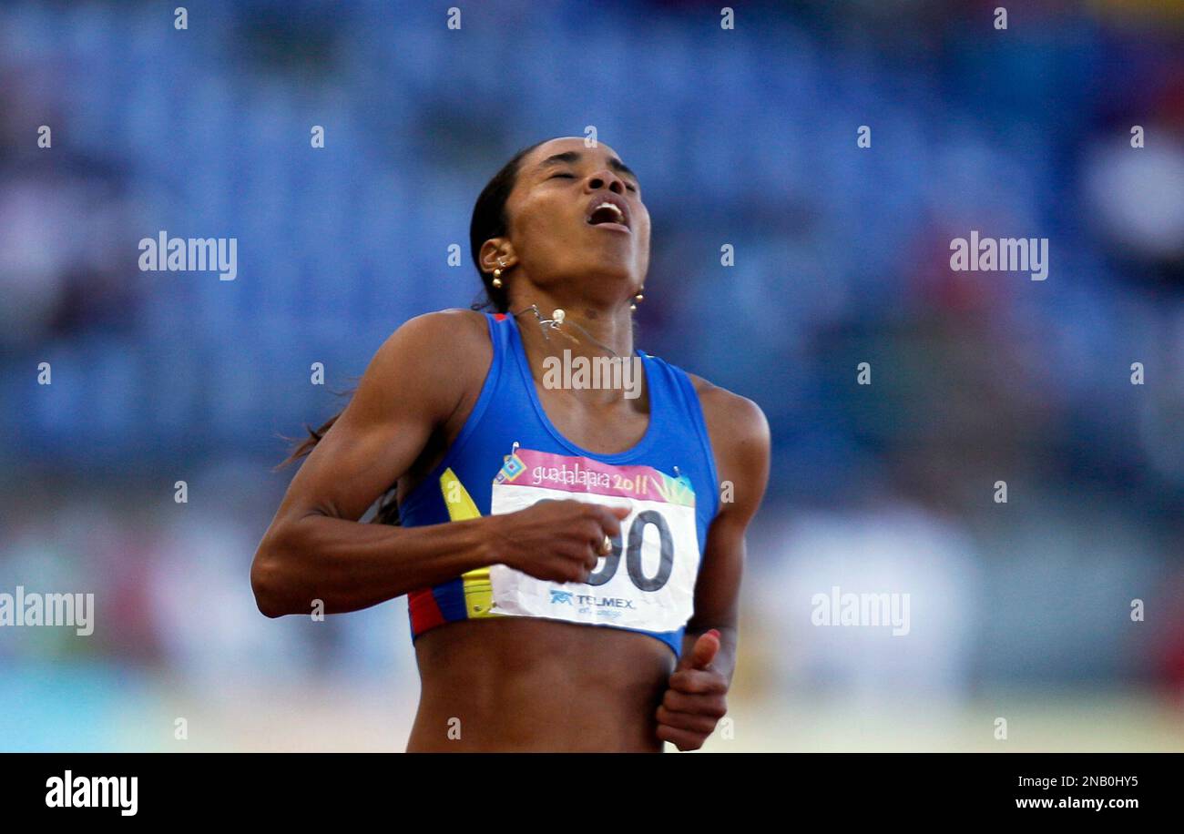 Colombia's Maria Oliveros (90) breathes after winning the women's 400m ...