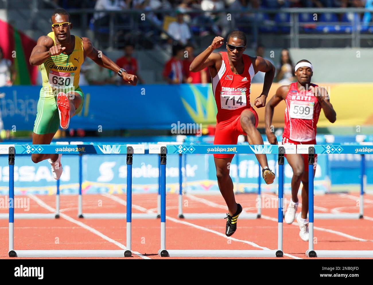 Jamaica's Isa Phillips, left, Trinidad's Emanuel Mayers, center, and ...