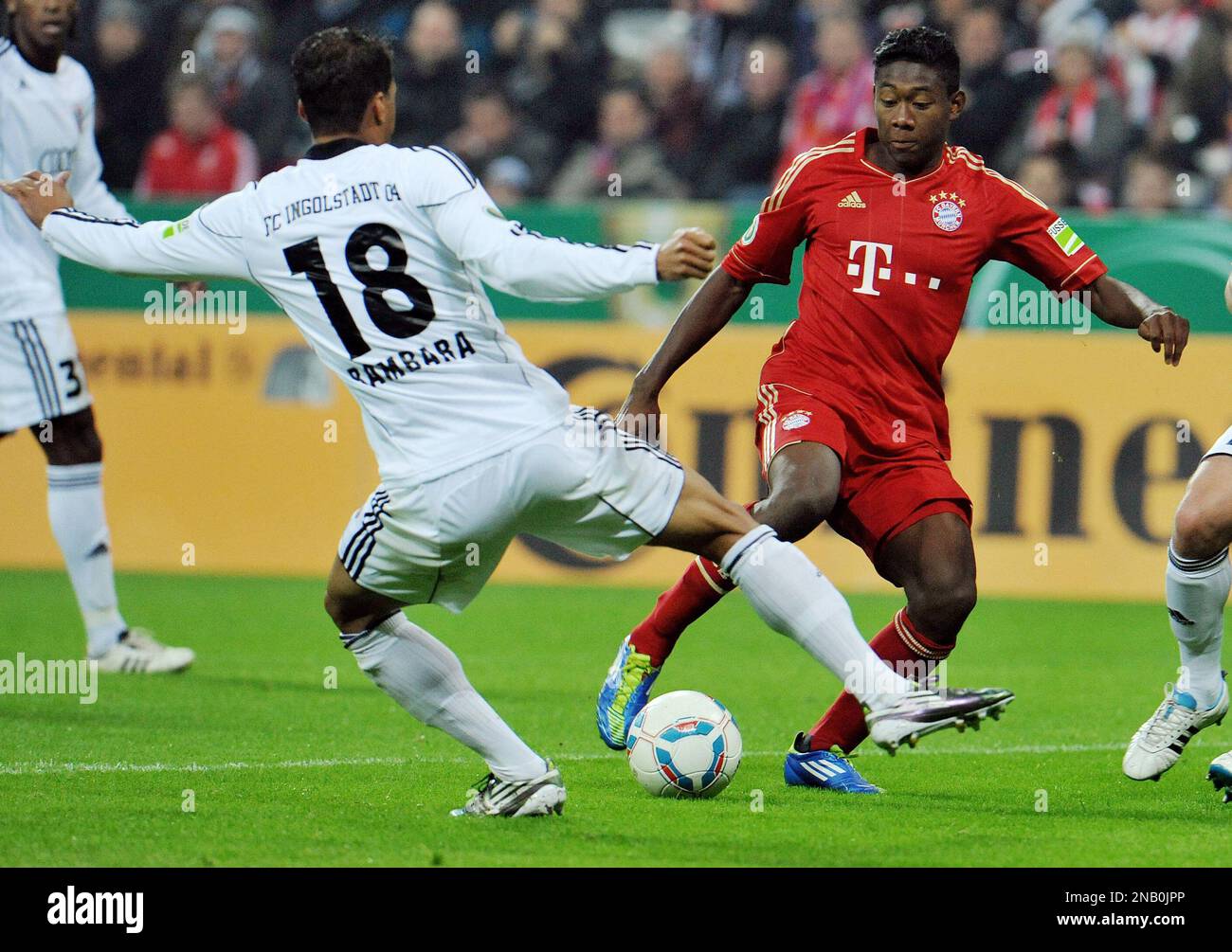 Munich's David Alaba of Austria, right, challenges for the ball with ...