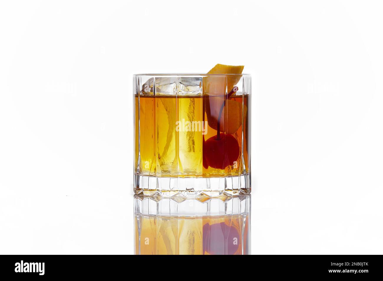 alcoholic cocktail of yellow color with a cherry, in an old-fashioned ...