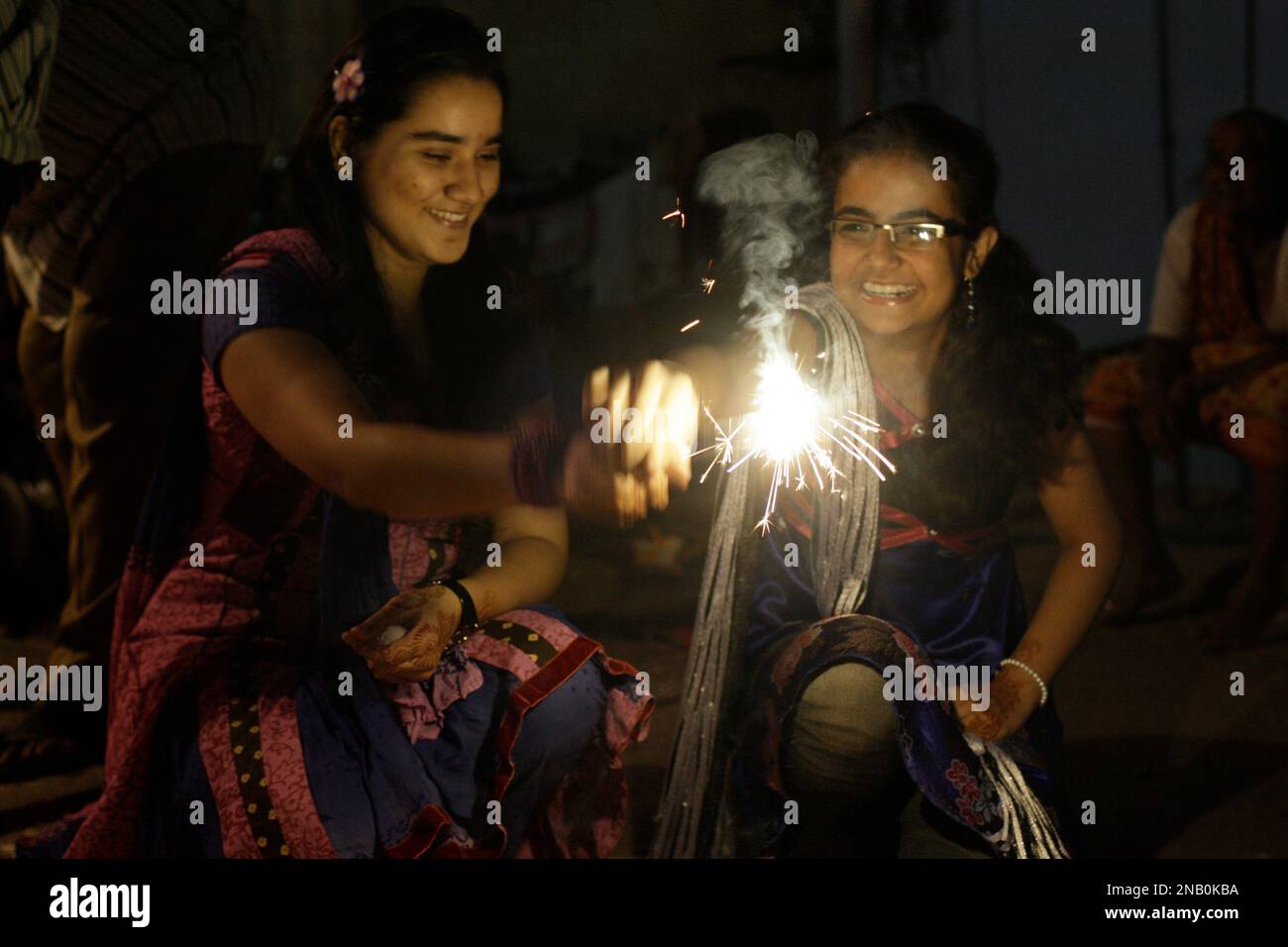 Pakistani Hindu girls hold firecrackers during Diwali, the Hindu ...