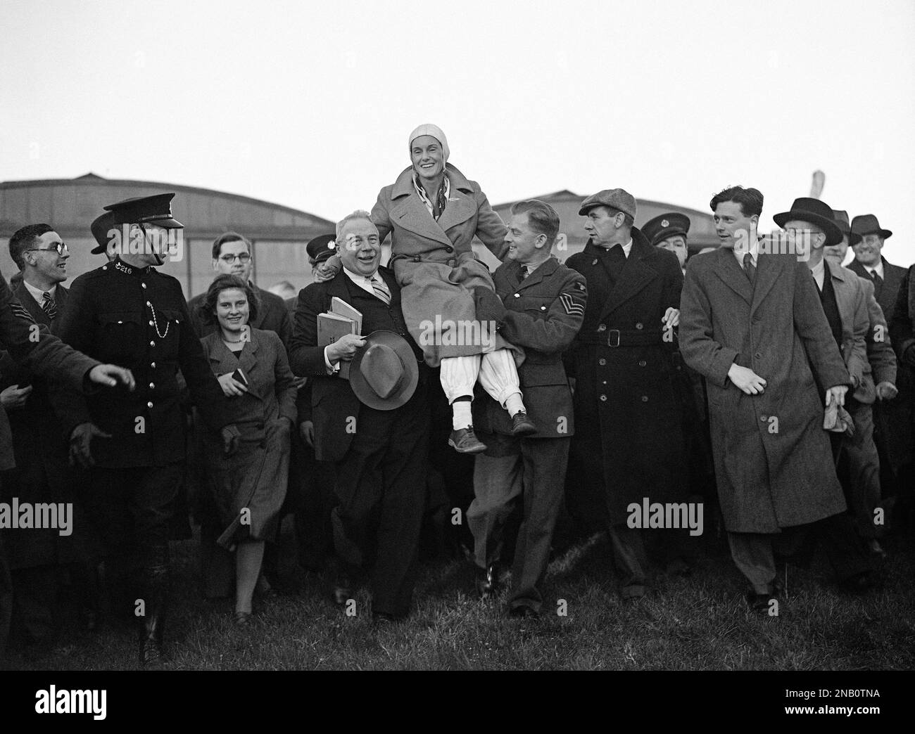 New Zealand pilot Jean Batten carried shoulder high when she landed at ...