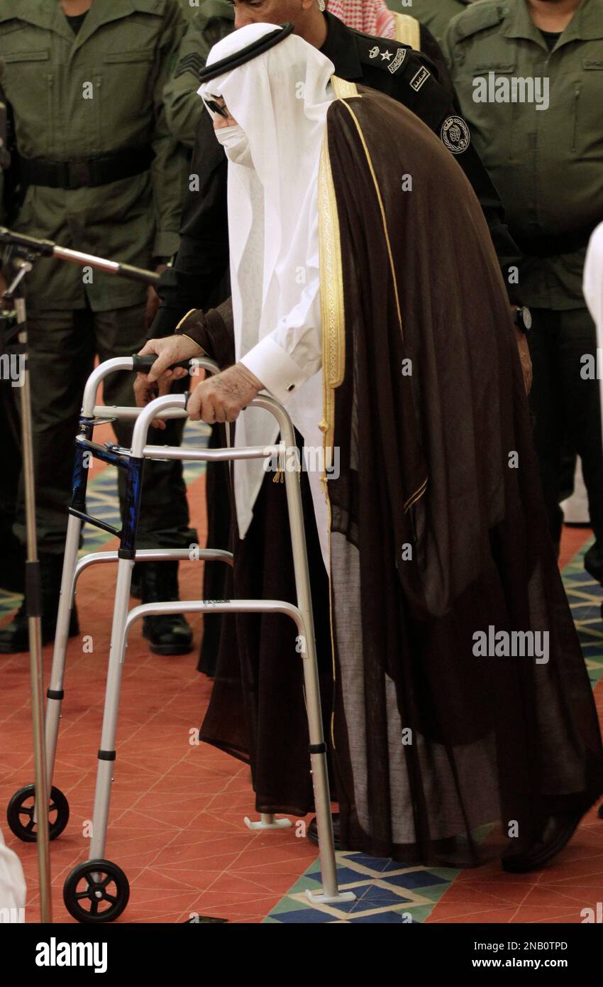 King Abdullah of Saudi Arabia using a walker arrives for the funeral of ...
