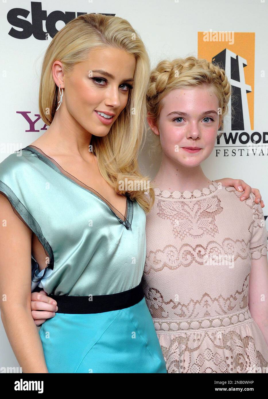 Winners of the Hollywood spotlight award Amber Heard, left, and Elle ...