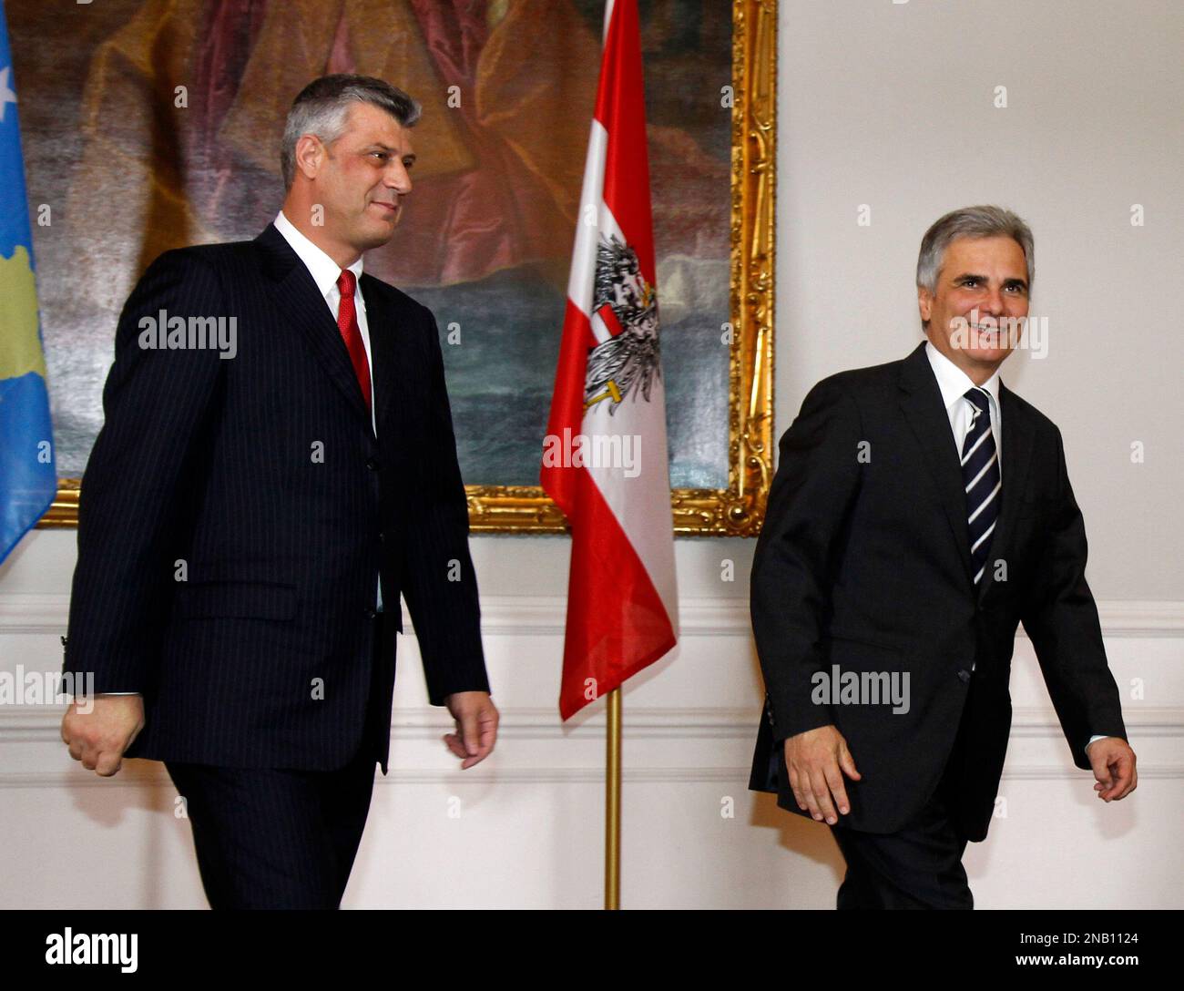 Austrian Chancellor Werner Faymann, right, welcomes Kosovo Prime ...