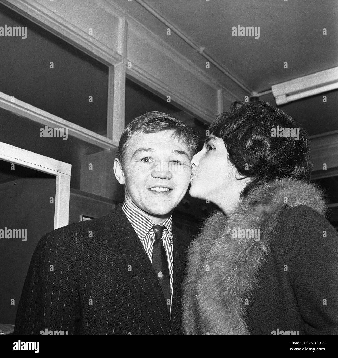 Former British featherweight boxing champion Terry Spinks, receiving a ...