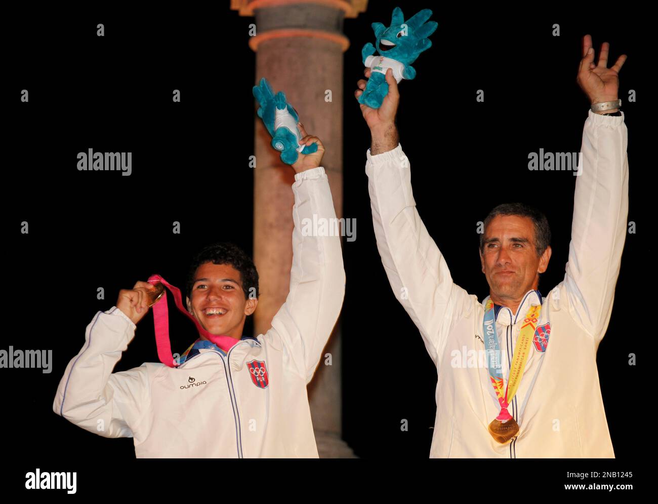 Puerto Rico's Victor Aponte, left, and Enrique Figueroa celebrate after ...