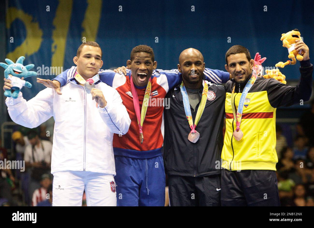 Gold medalist Livan Lopez, of Cuba, center left, silver medalist Pedro ...