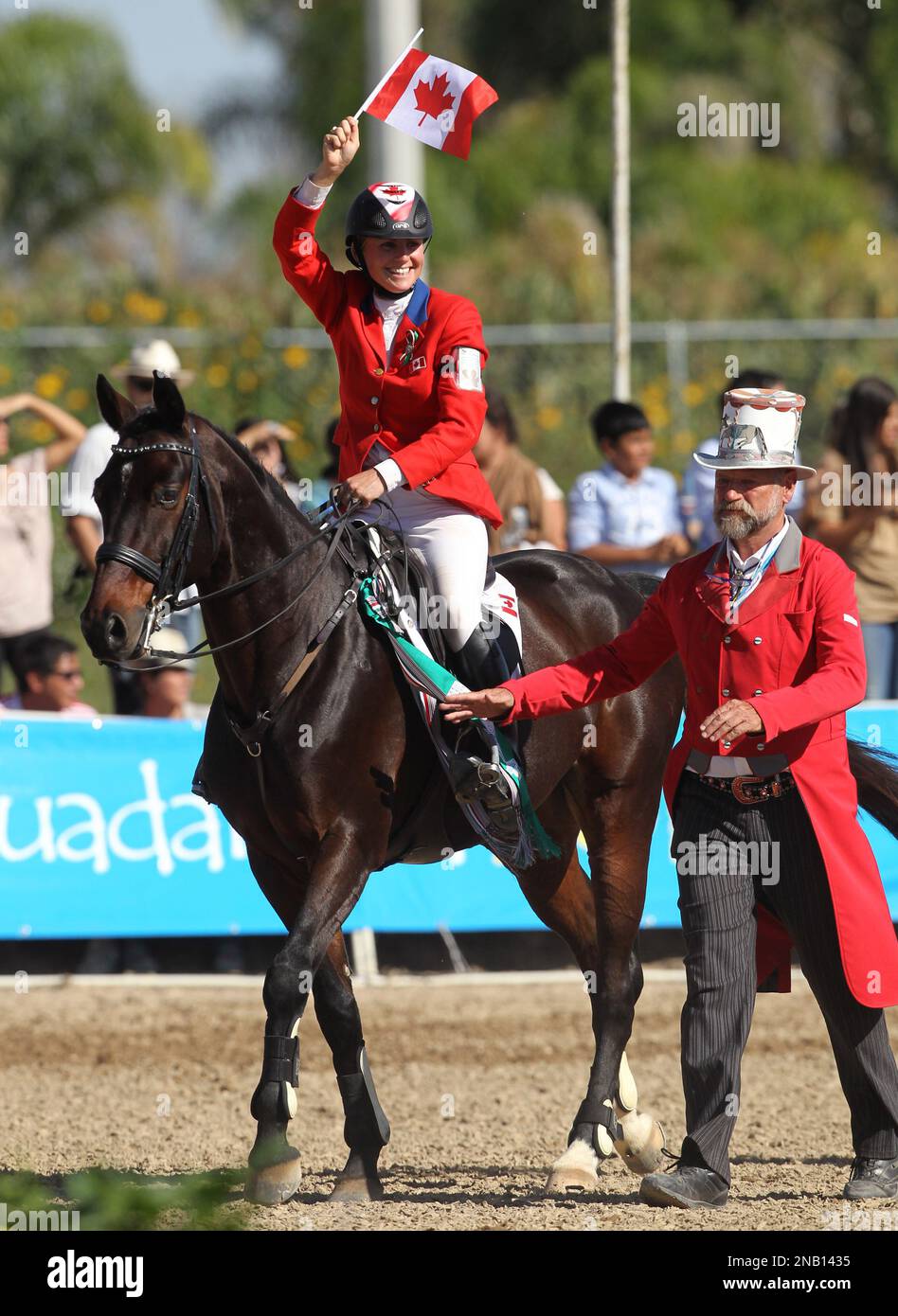 Canada's Jessica Phoenix rides Pavarotti as she celebrates waving a ...