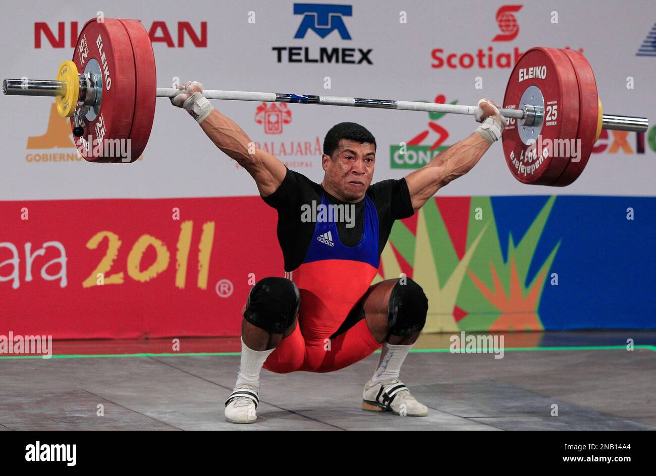 Colombia's Diego Salazar lifts 132 kg in the snatch of the ...
