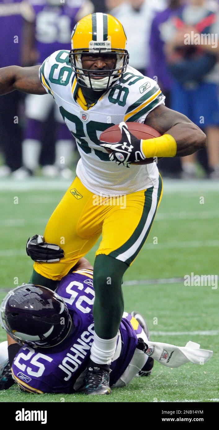 Green Bay Packers wide receiver James Jones tries to break a tackle by ...