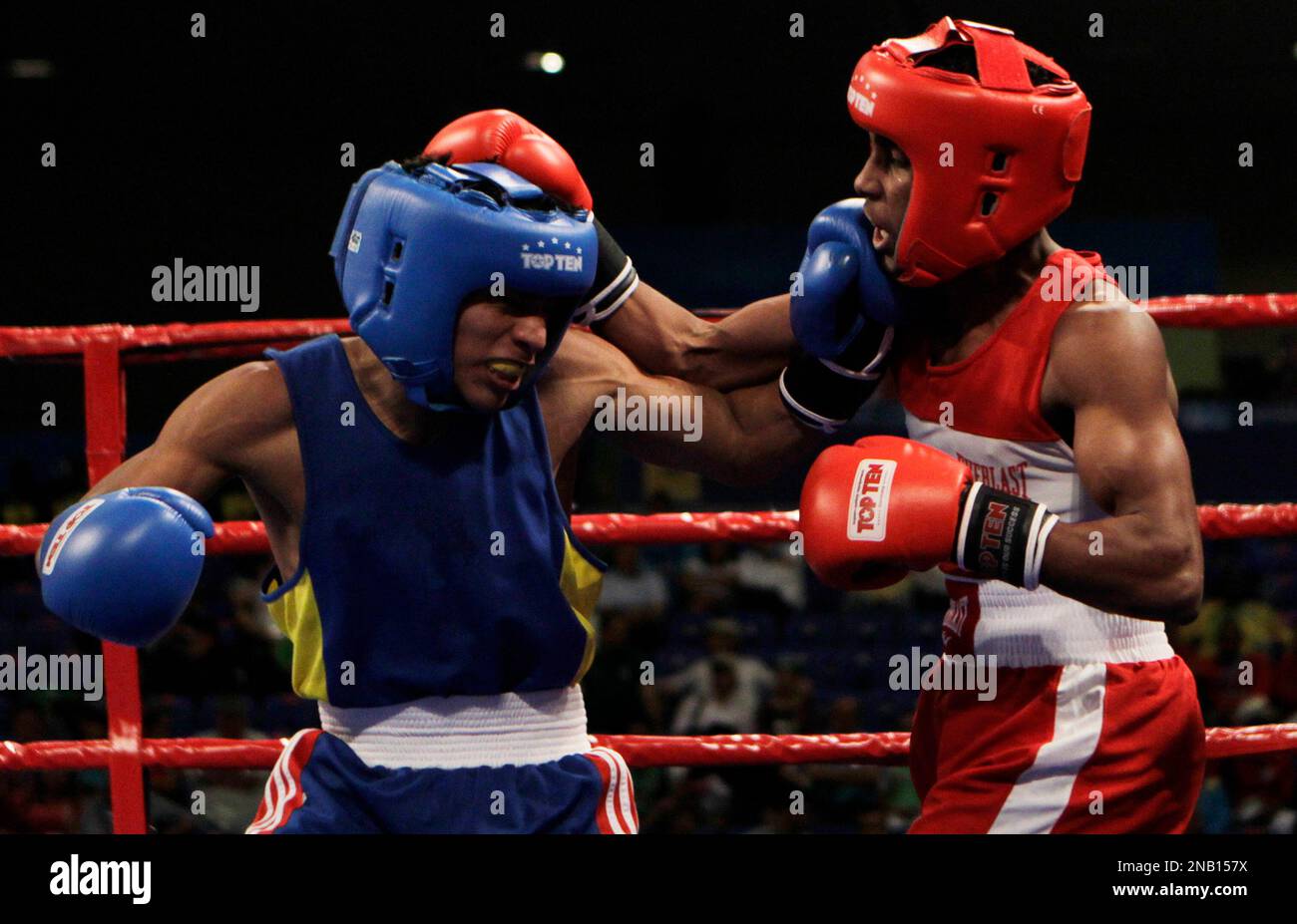 Juan Medina, left, of the Dominican Republic, fights with Carlos Quipo ...