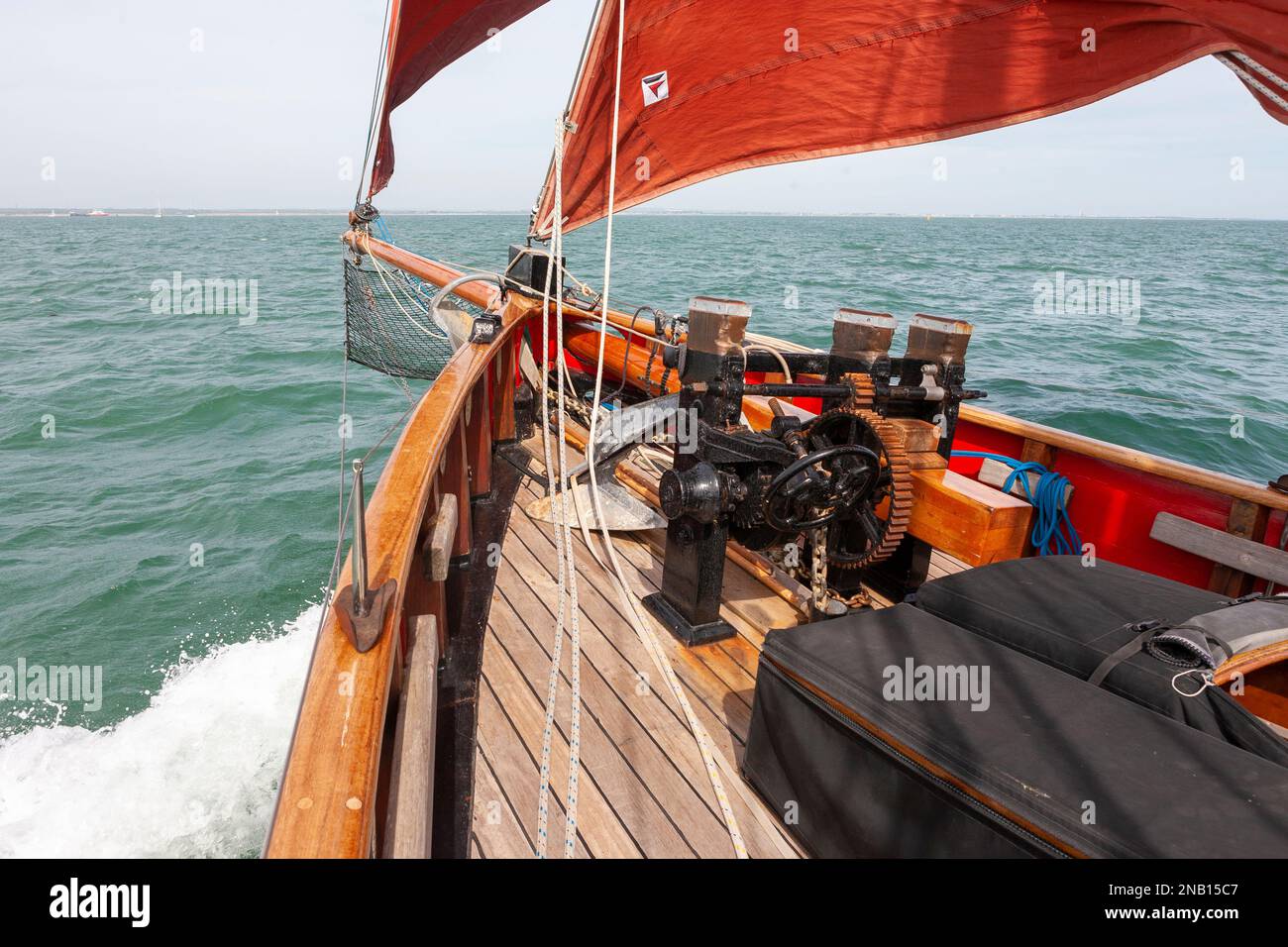 On board the traditional gaff cutter "Jolie Brise" as she reaches ...