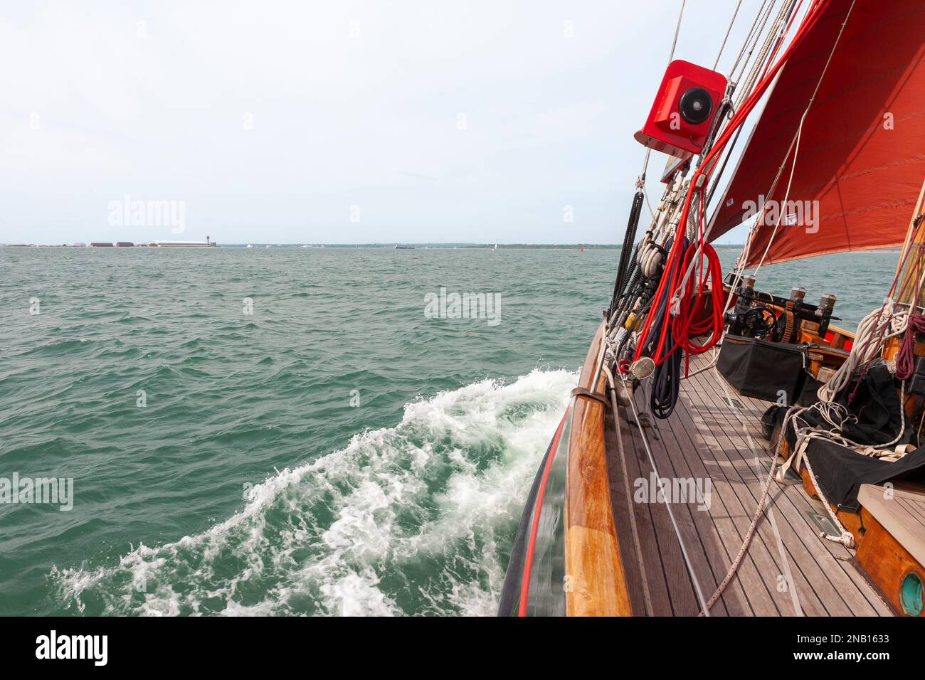 On board the traditional gaff cutter "Jolie Brise" as she reaches ...