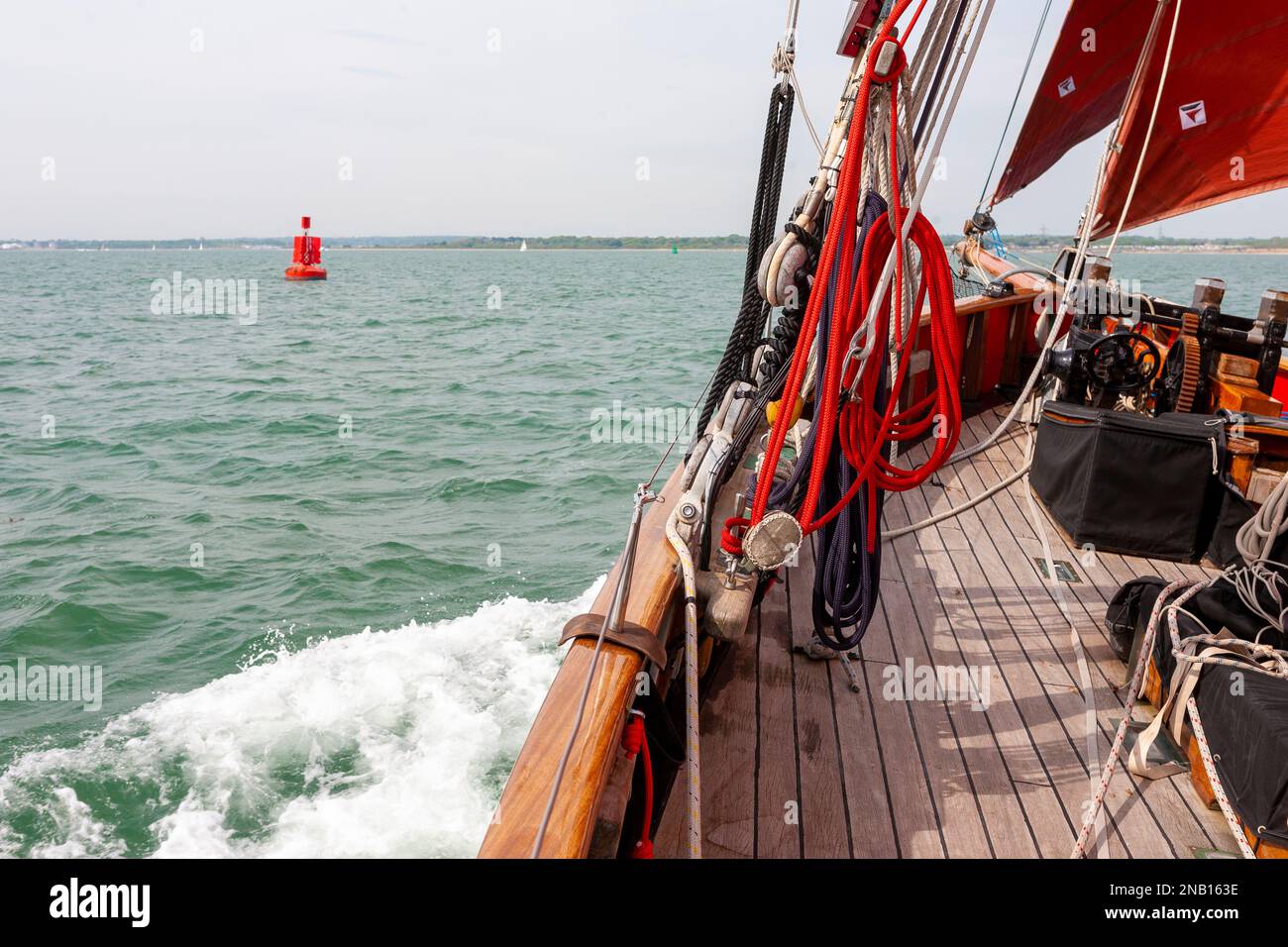 On board the traditional gaff cutter "Jolie Brise" as she reaches ...