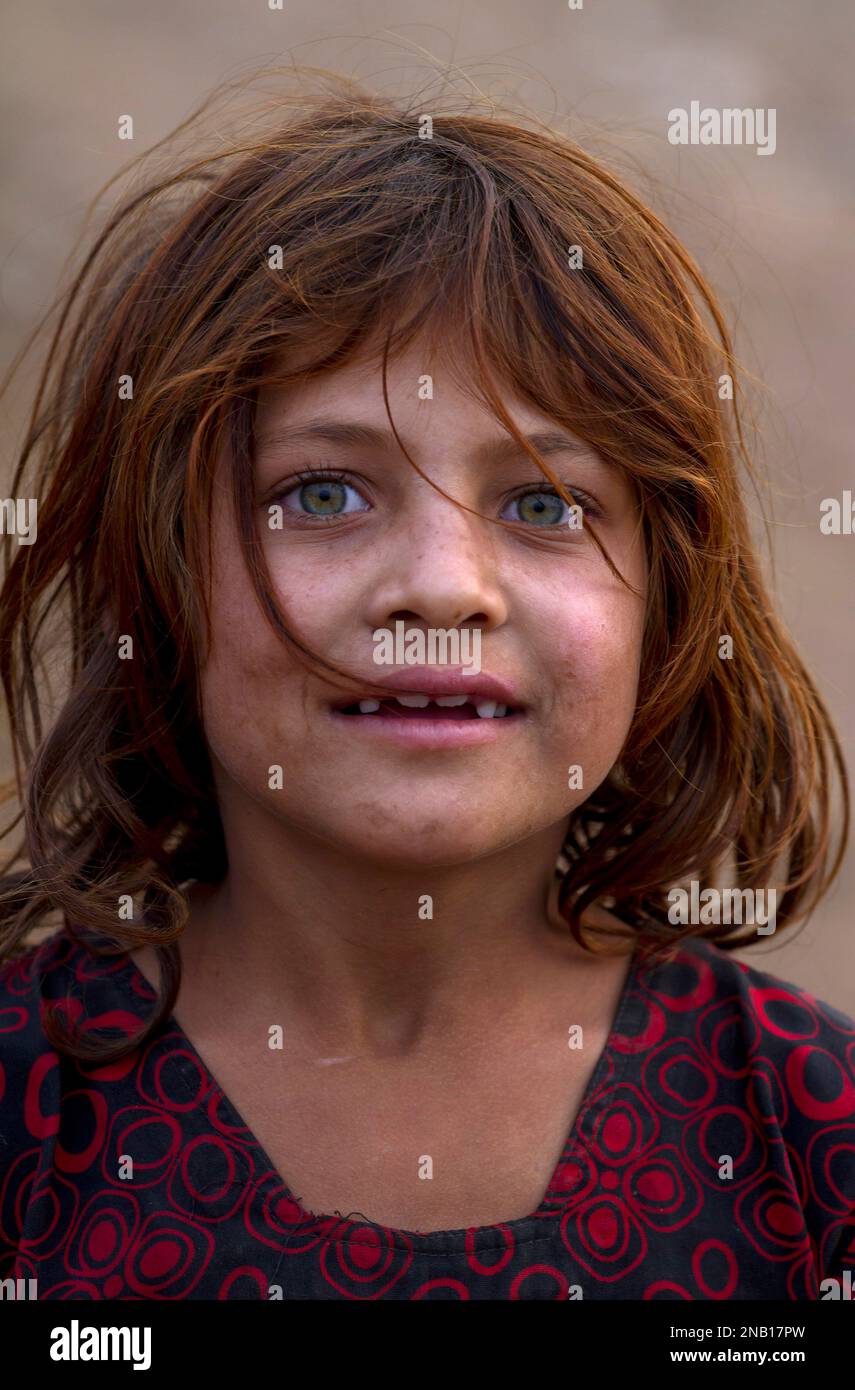 A girl from Pakistani tribal area Bajur poses for photograph while she ...