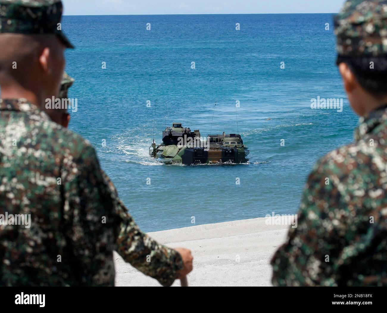 Philippine marines watch as an amphibious assault vehicle (AAV) of the ...