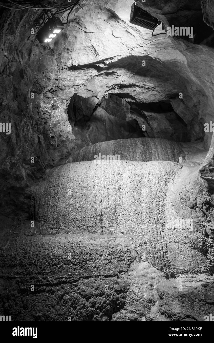 Black and white photo of The Fonts rock formation inside Goughs Cave in ...