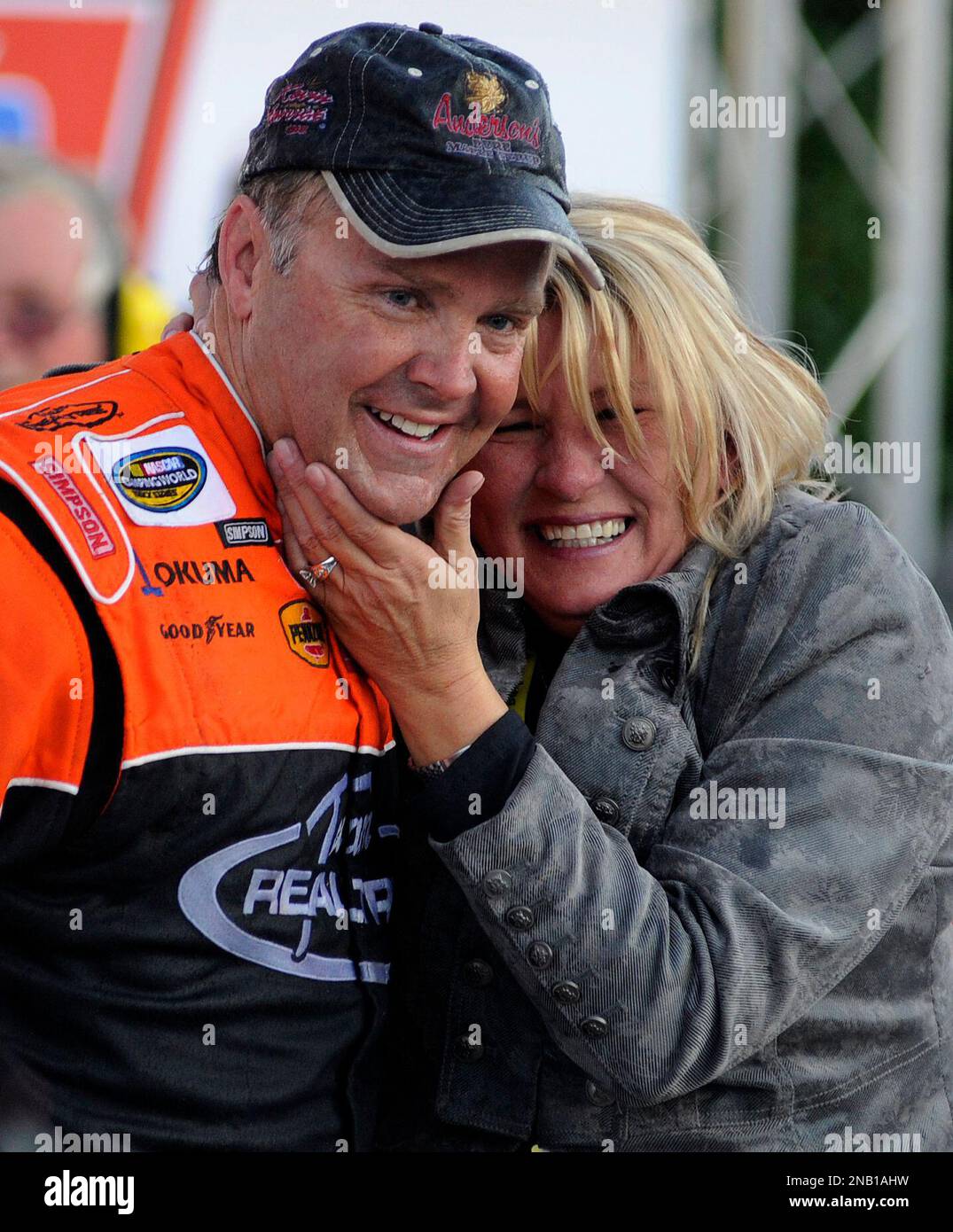 Mike Wallace celebrates with his wife, Carla, after winning the NASCAR ...