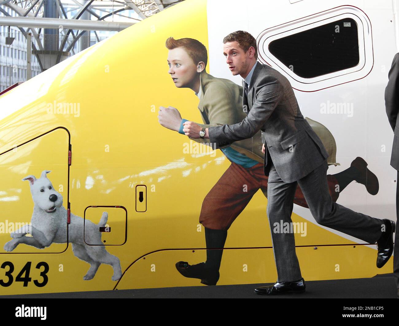 British actor Jamie Bell poses next to Belgian cartoon hero Tintin ...