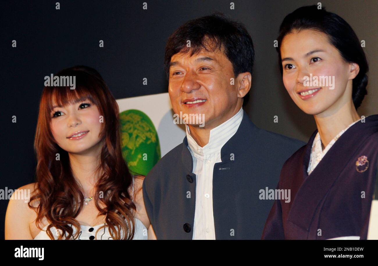 Hong Kong movie star Jackie Chan, center, Japanese actress Makiko Esumi ...