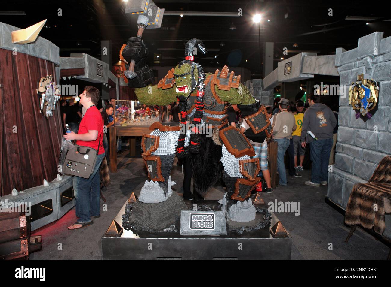 Fans and players look at a Thrall statue in the World of Warcraft ...