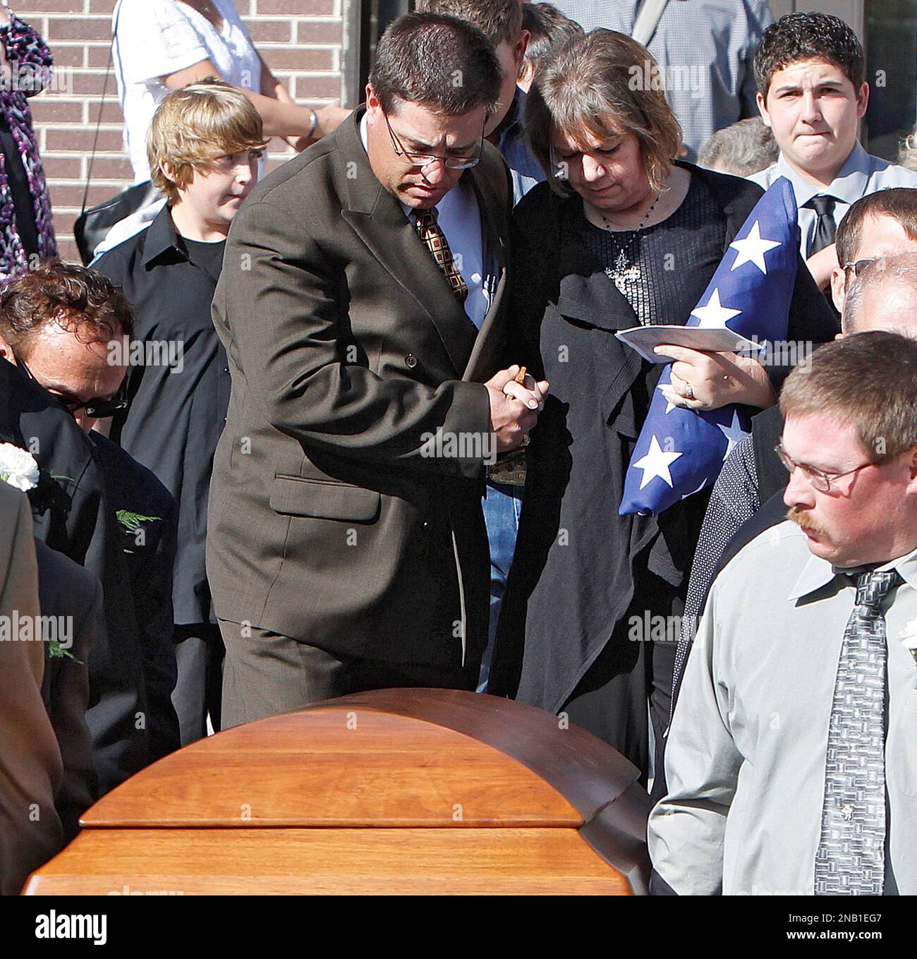 Melody Mitchell the wife of sheriff's deputy Howard Mitchell is helped ...