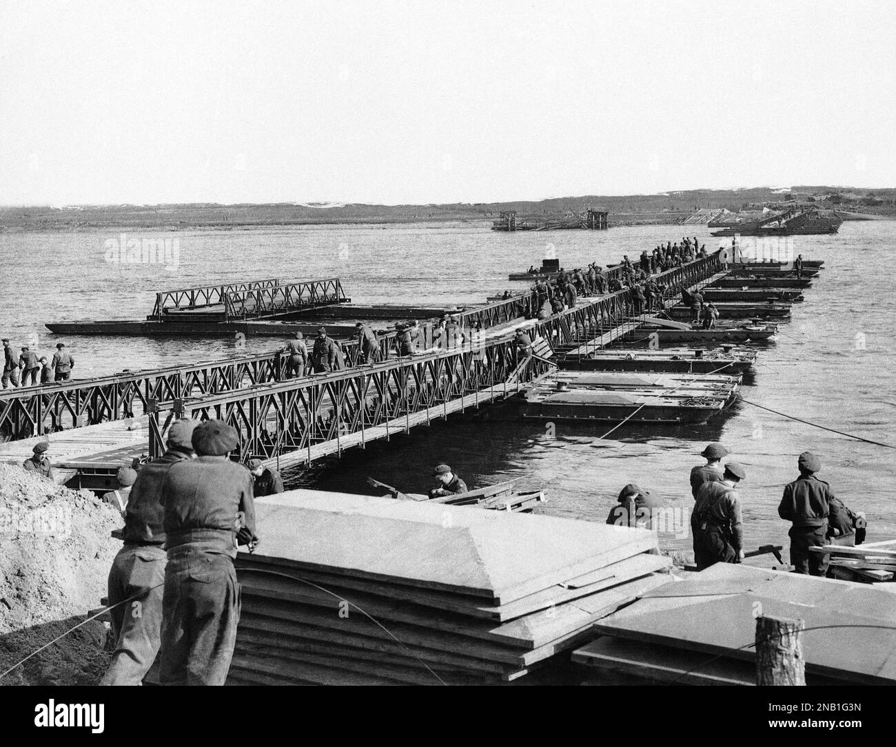 Engineers of Montgomery’s 21st Army group work on a pontoon bridge ...