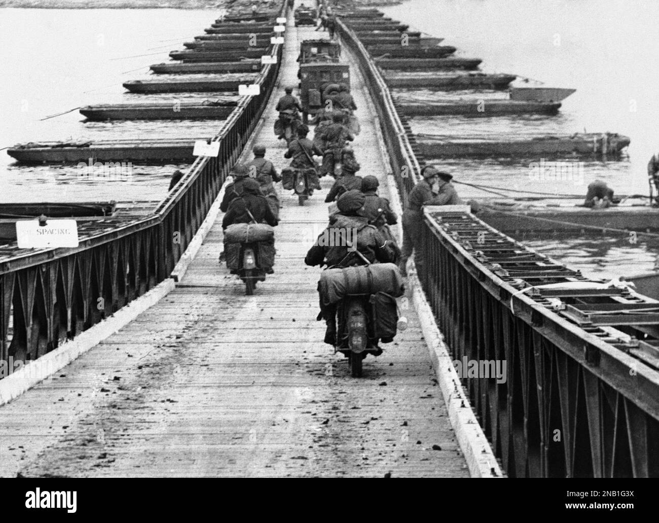 British units cross a pontoon bridge spanning the Rhine on their way to ...