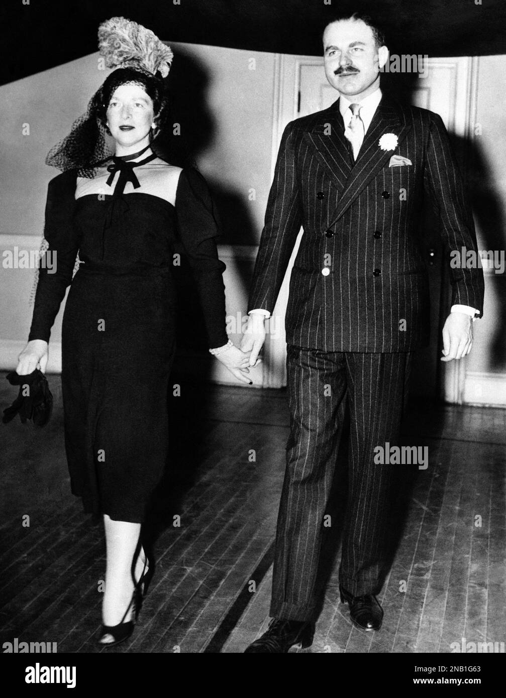 Ernest A. Simpson, former husband of the Duchess of Windsor, walking ...