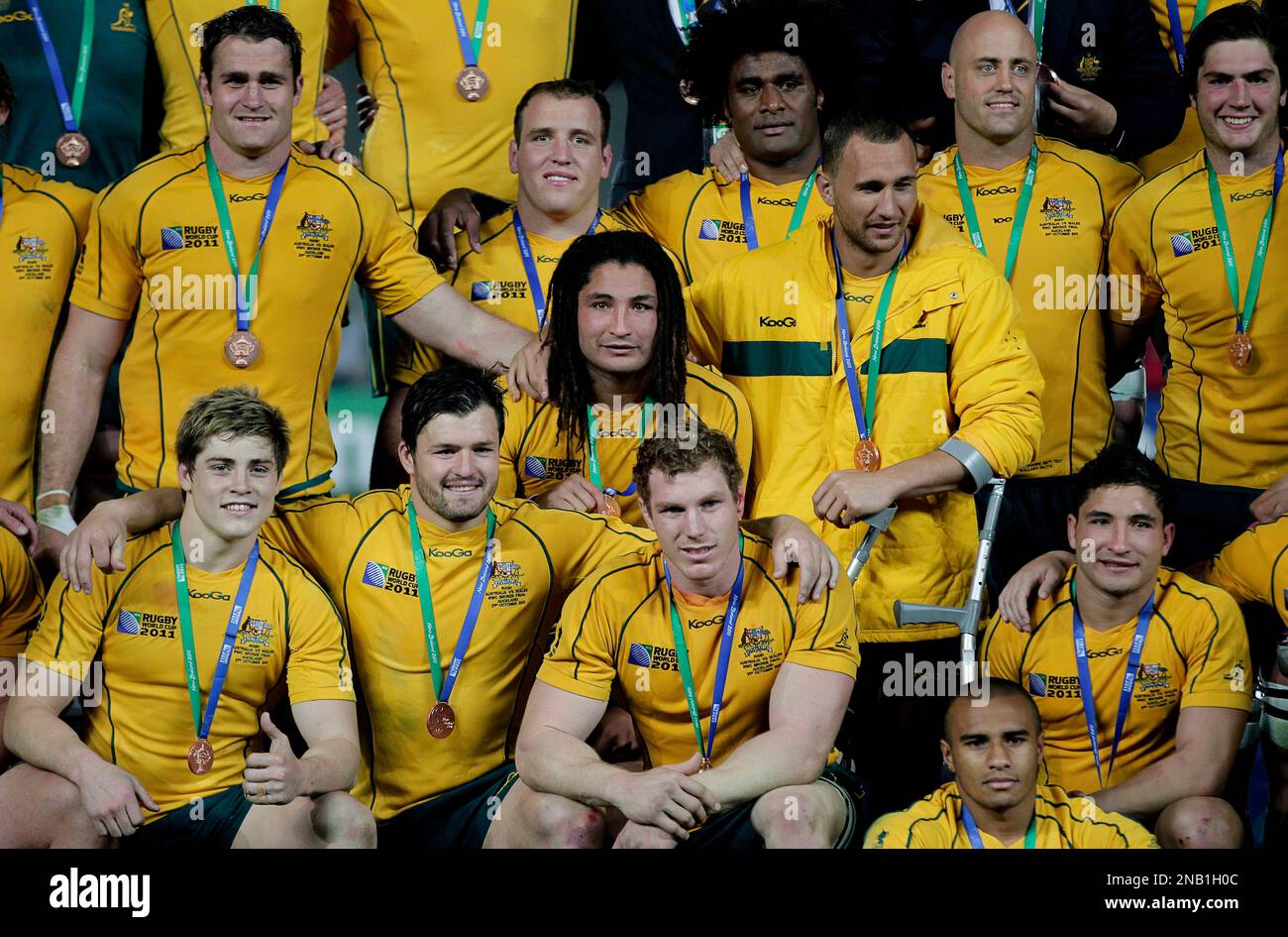 Australia team players and staff members pose with their medals after ...